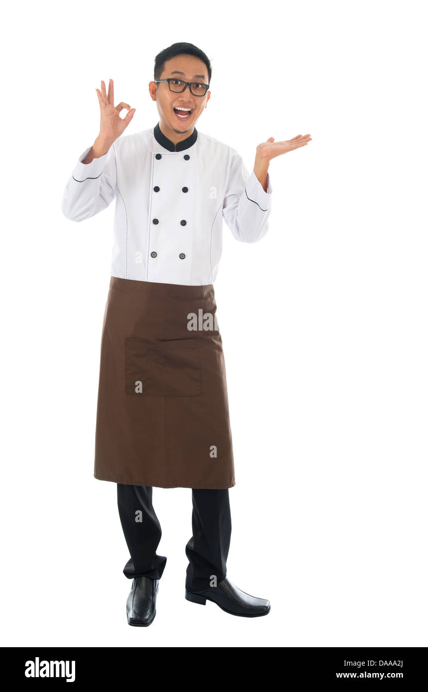 Portrait of full body Asian male chef showing copy space and okay hand ...