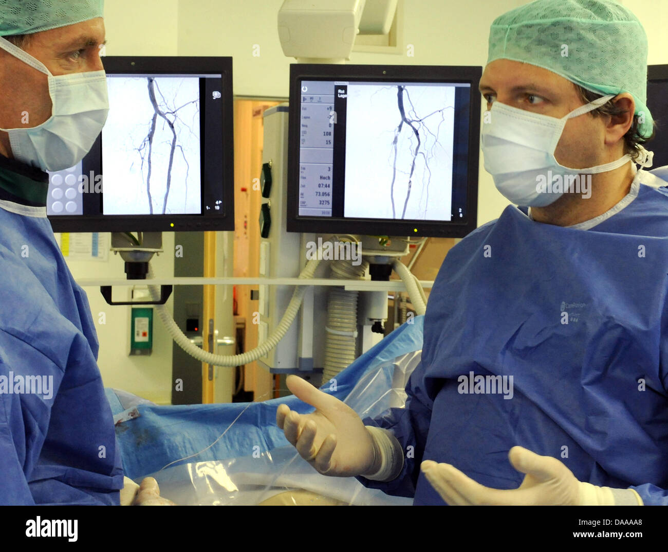Prof Dr Dierk Scheinert presents a stent covered with medicine to be ...