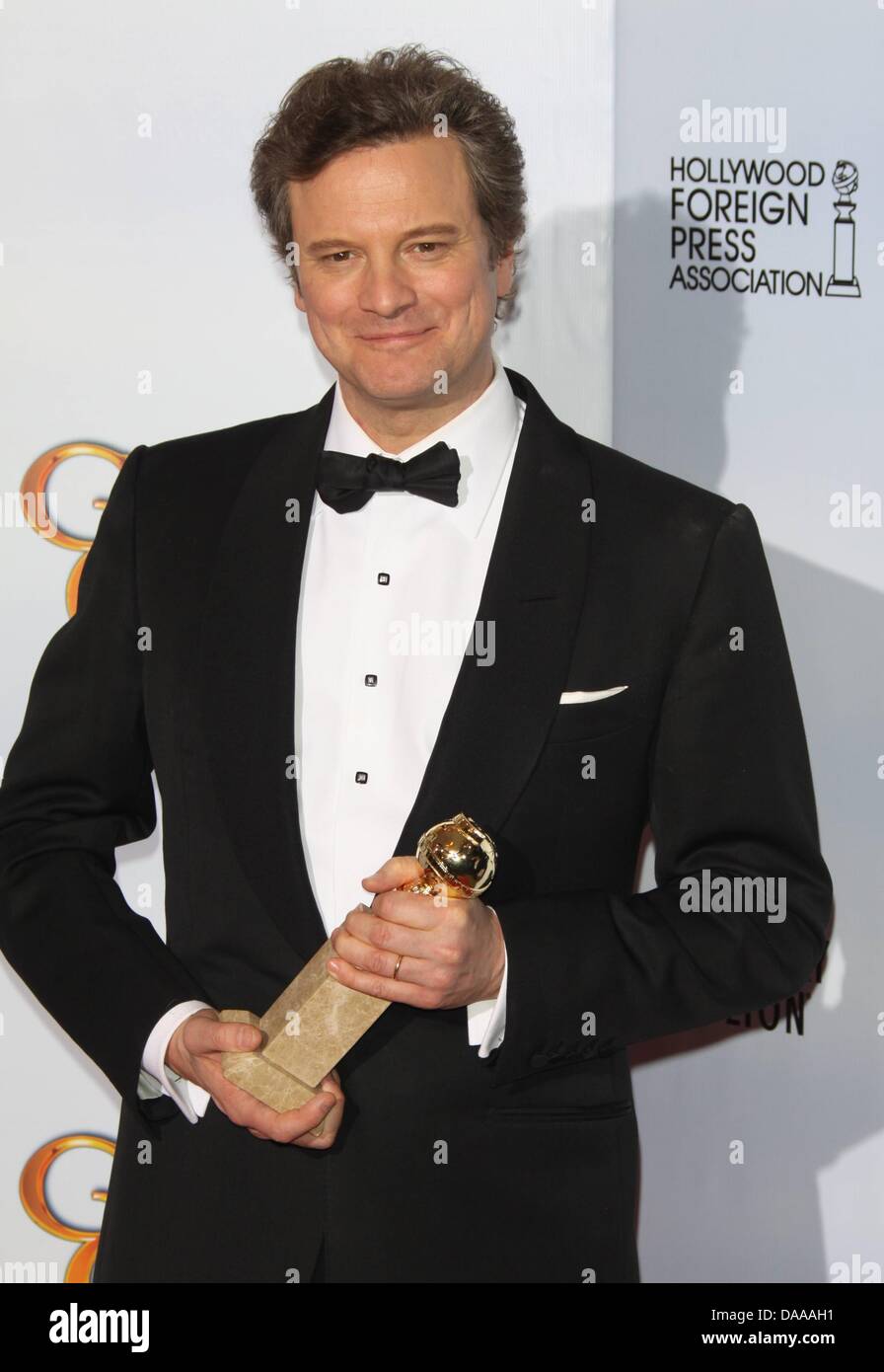 British actor Colin Firth holds up his award for 'Best Performance by ...