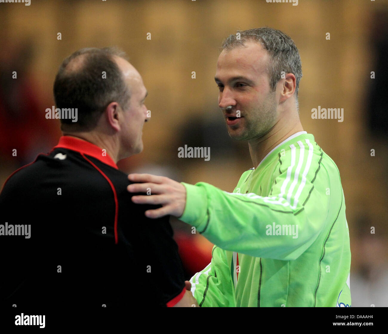 Thierry Omeyer of France (R) talks with Egypt's head coach Joern-Uwe ...