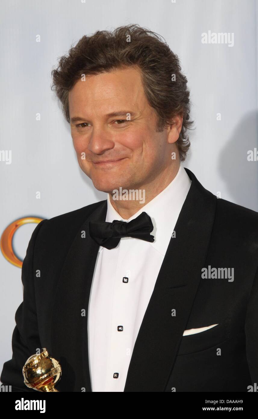 British actor Colin Firth holds up his award for 'Best Performance by ...