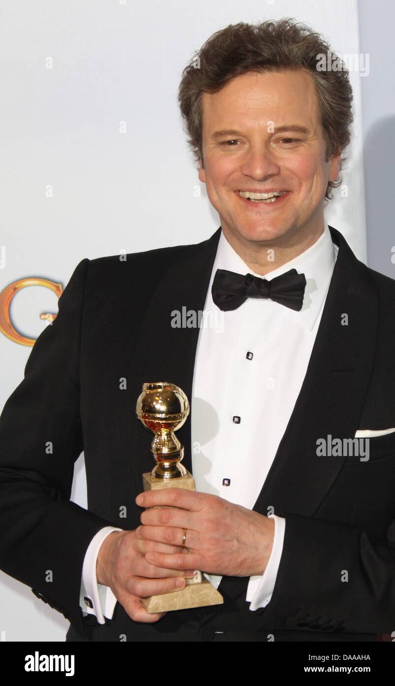 British actor Colin Firth holds up his award for 'Best Performance by ...