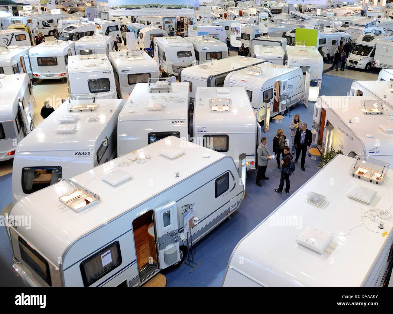 Visitors of the Tourism trade show CMT look at caravans in Stuttgart ...