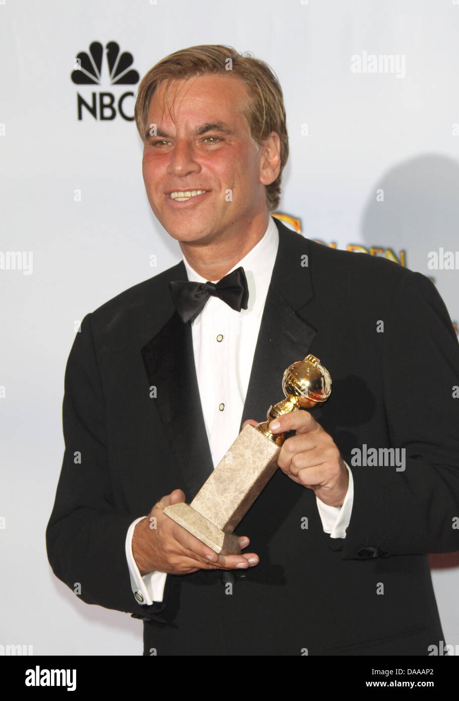 US writer and producer Aaron Sorkin holds his award for Best Screenplay ...