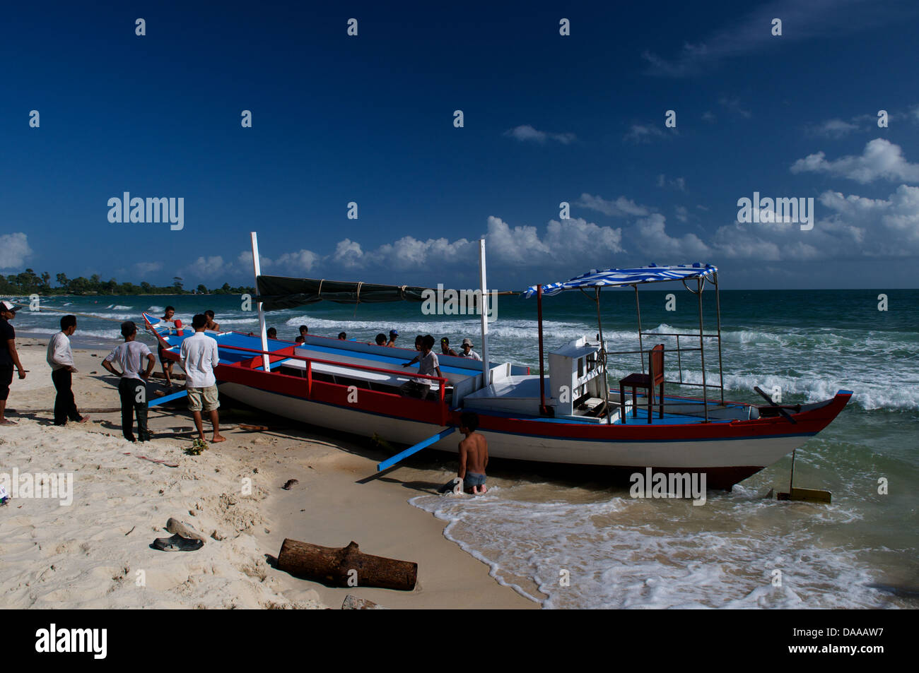 Khmer men repair boat on Independence Beach, Kampong Saom ...