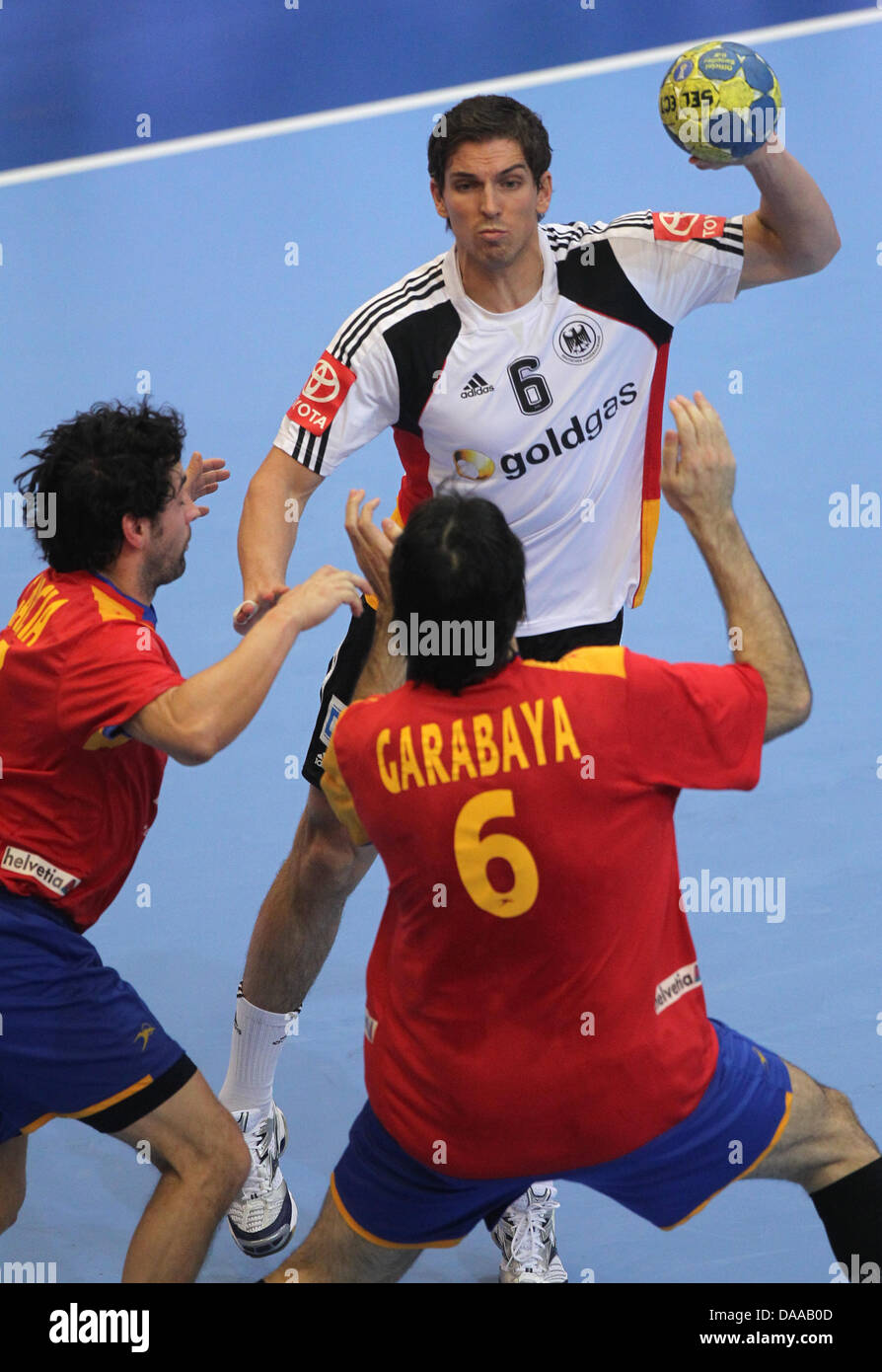 Adrian Pfahl (R) of Germany against Ruben Arenas Garabaya (front) and ...