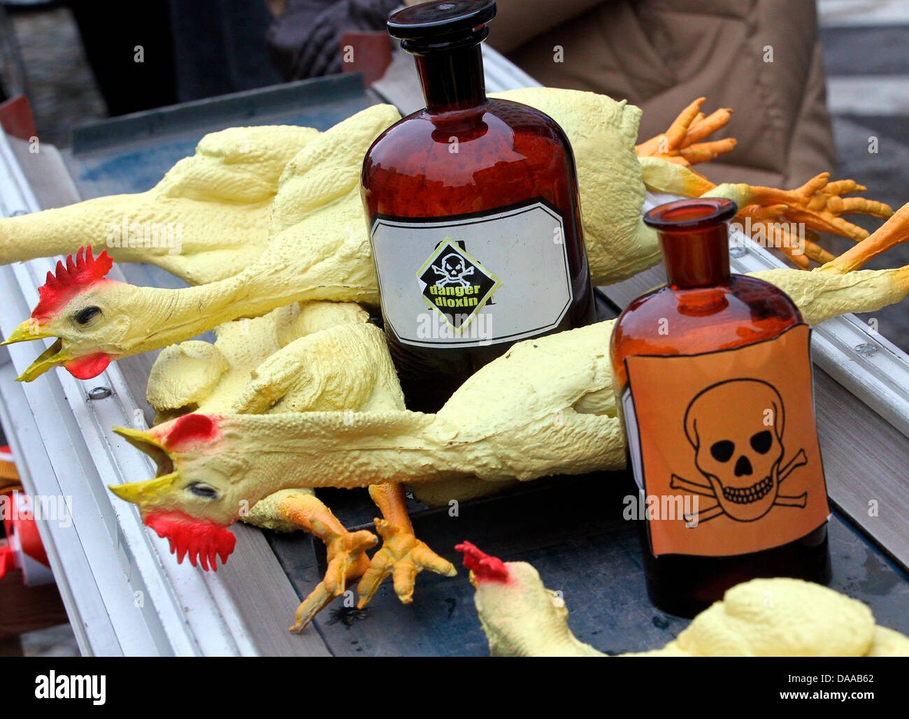 Rubber chickens and bottles with poisonous material are presented by ...
