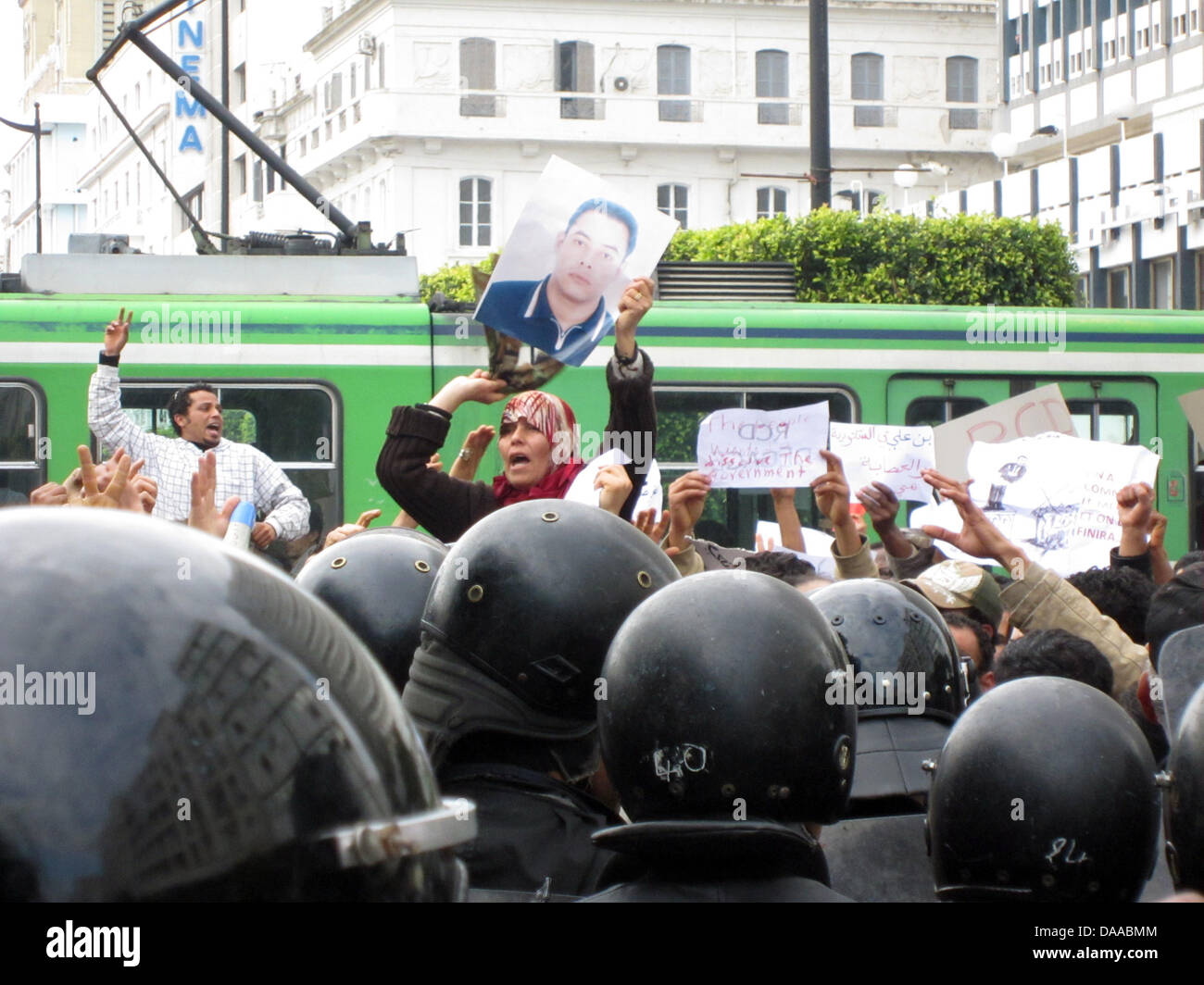 A woman shows a picture of the young man that initiated a wave of ...