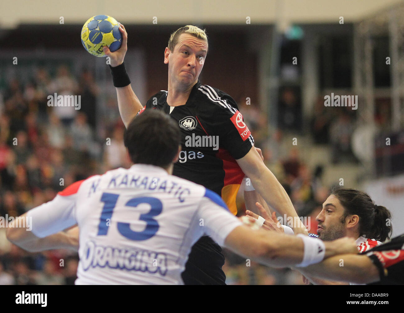 Pascal Hens (top) of Germany against Nikola Karabatic (L) and Bertrand ...