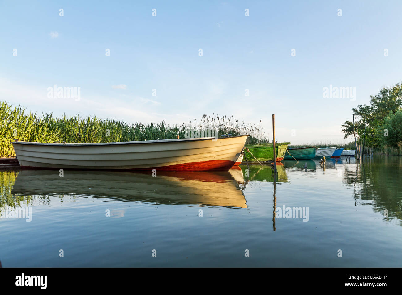 Still-life with boats at sunset Stock Photo - Alamy