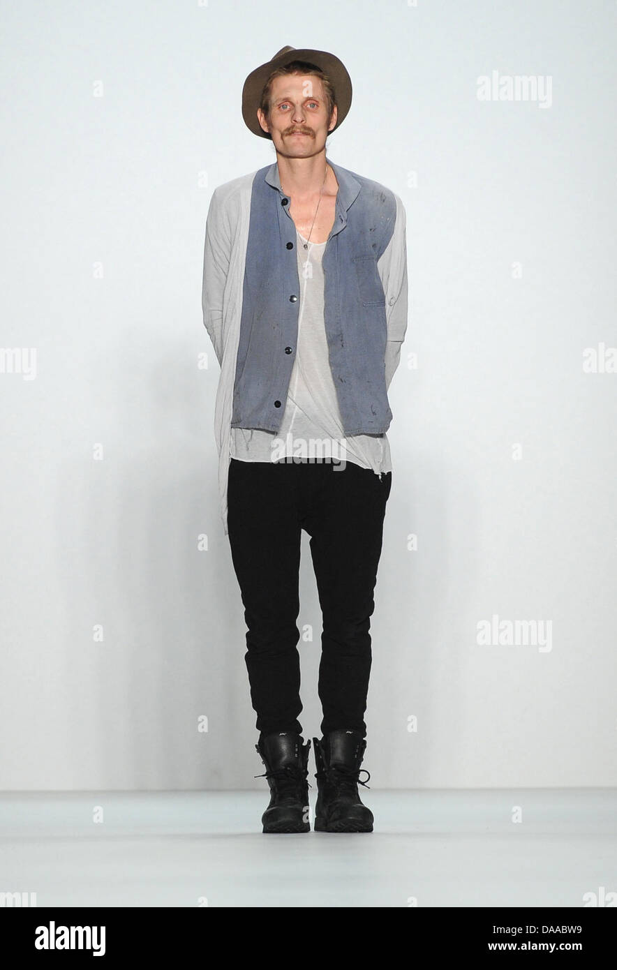 Designer Patrick Mohr appears on stage at his fashion show during the ...