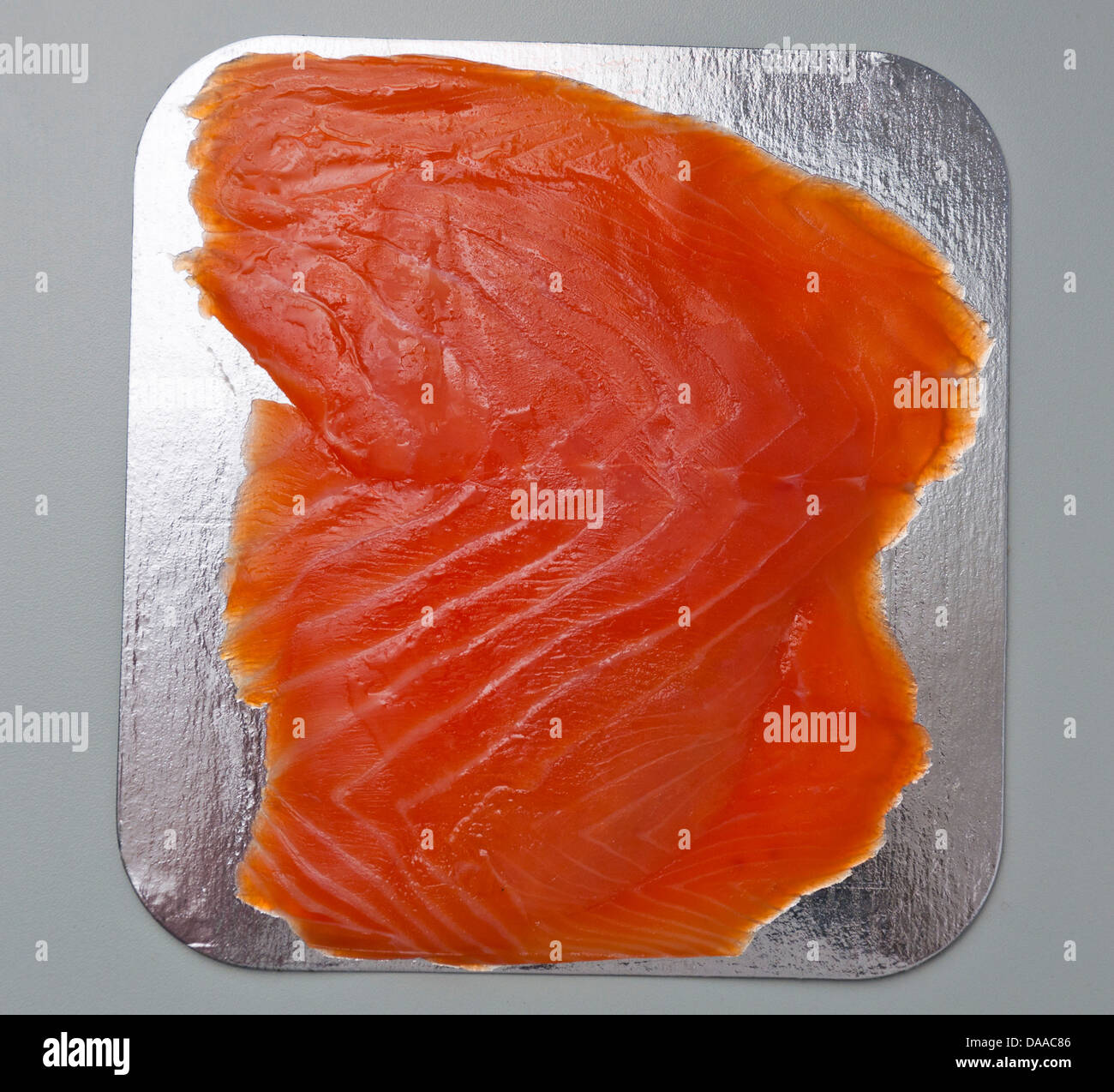 Smoked salmon slices on foil backed packaging Stock Photo - Alamy