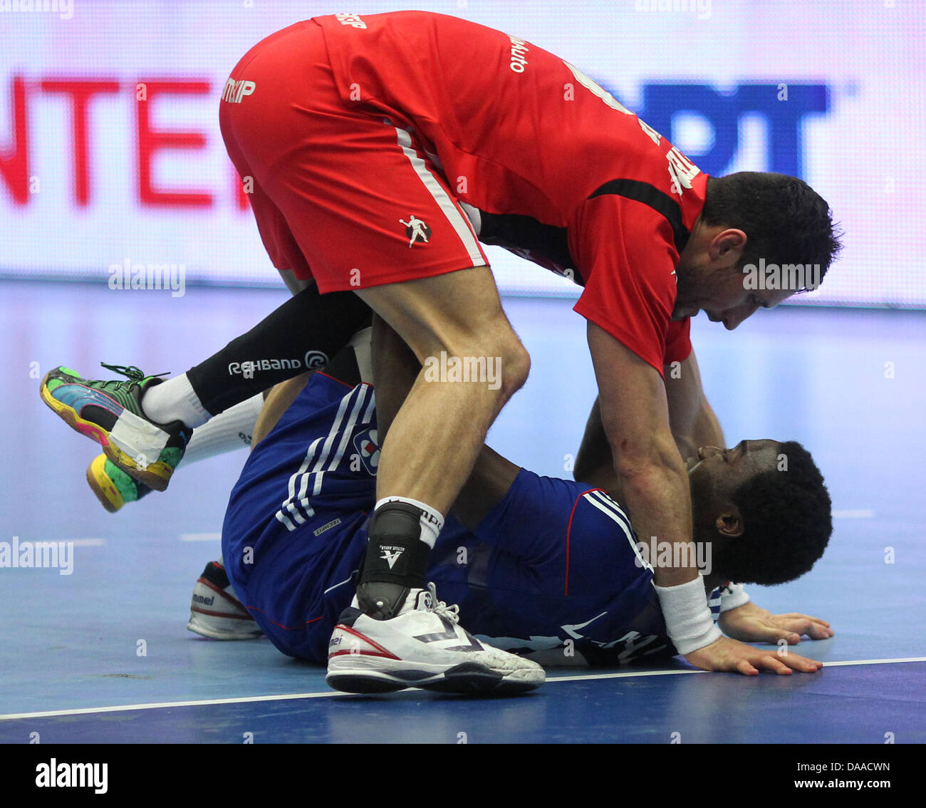 Luc Abalo of France (down) against Alexander Petersson of Iceland ...
