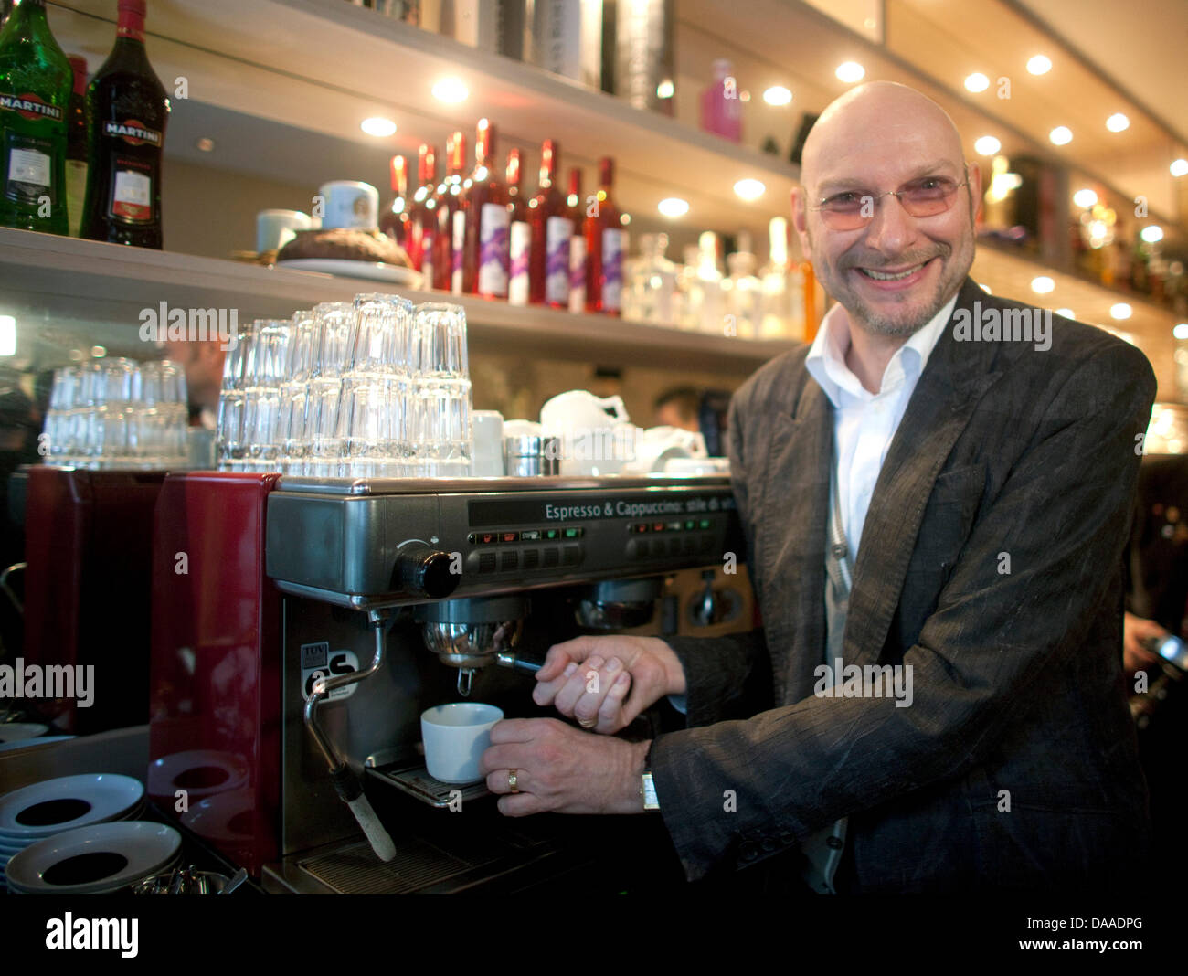 German TV host and actor Ralph Morgenstern smiles in his new cafe in ...