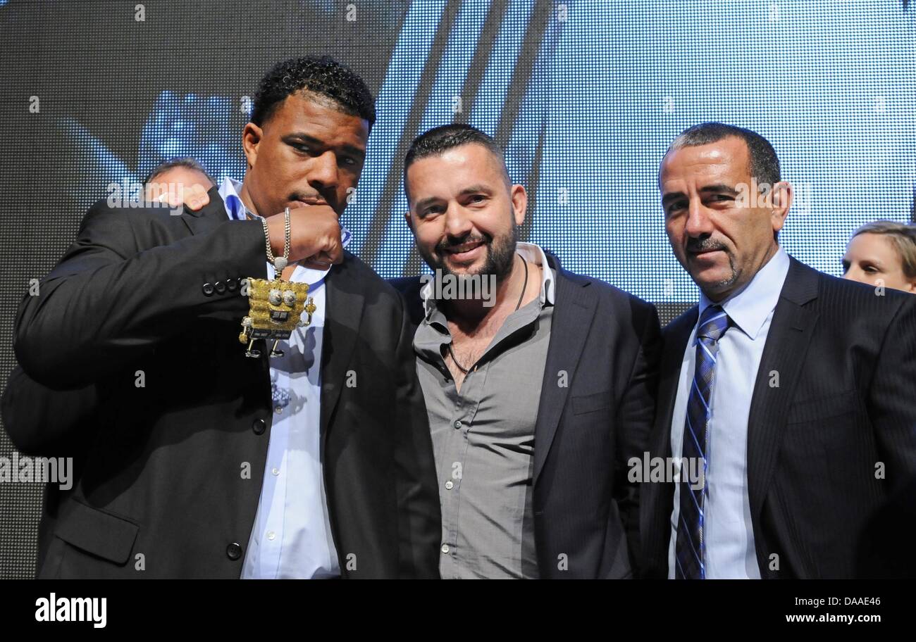 (L-R) Cuban heavyweight boxer Odlanier Solis, Promoter Ahmet Oner and ...