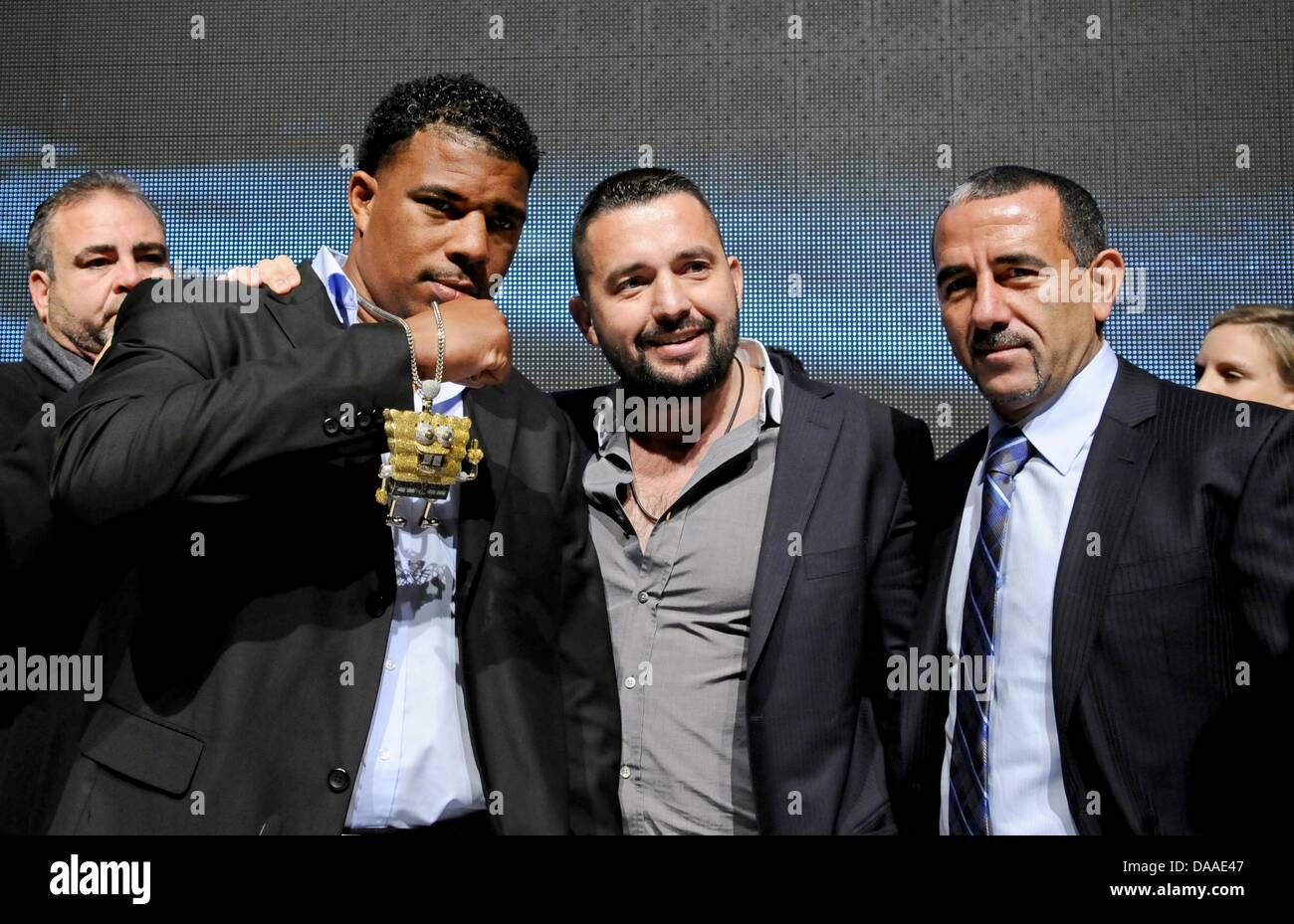 (L-R) Cuban heavyweight boxer Odlanier Solis, Promoter Ahmet Oner and ...