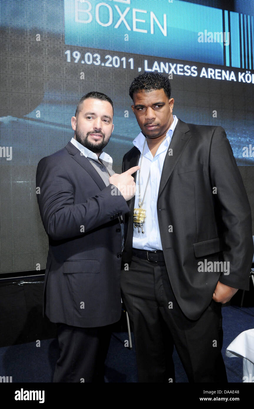 Cuban heavyweight boxer Odlanier Solis (R) and promoter Ahmet Oner (L ...