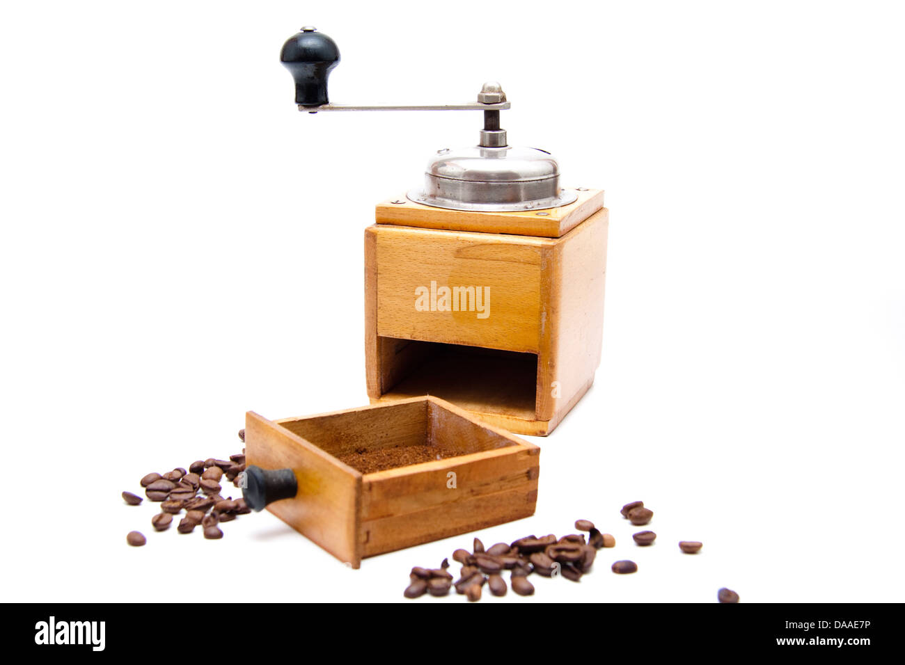 Old coffee mill with coffee beans Stock Photo - Alamy