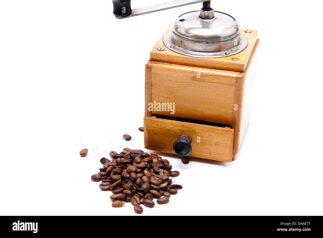 Old coffee mill with coffee beans Stock Photo - Alamy