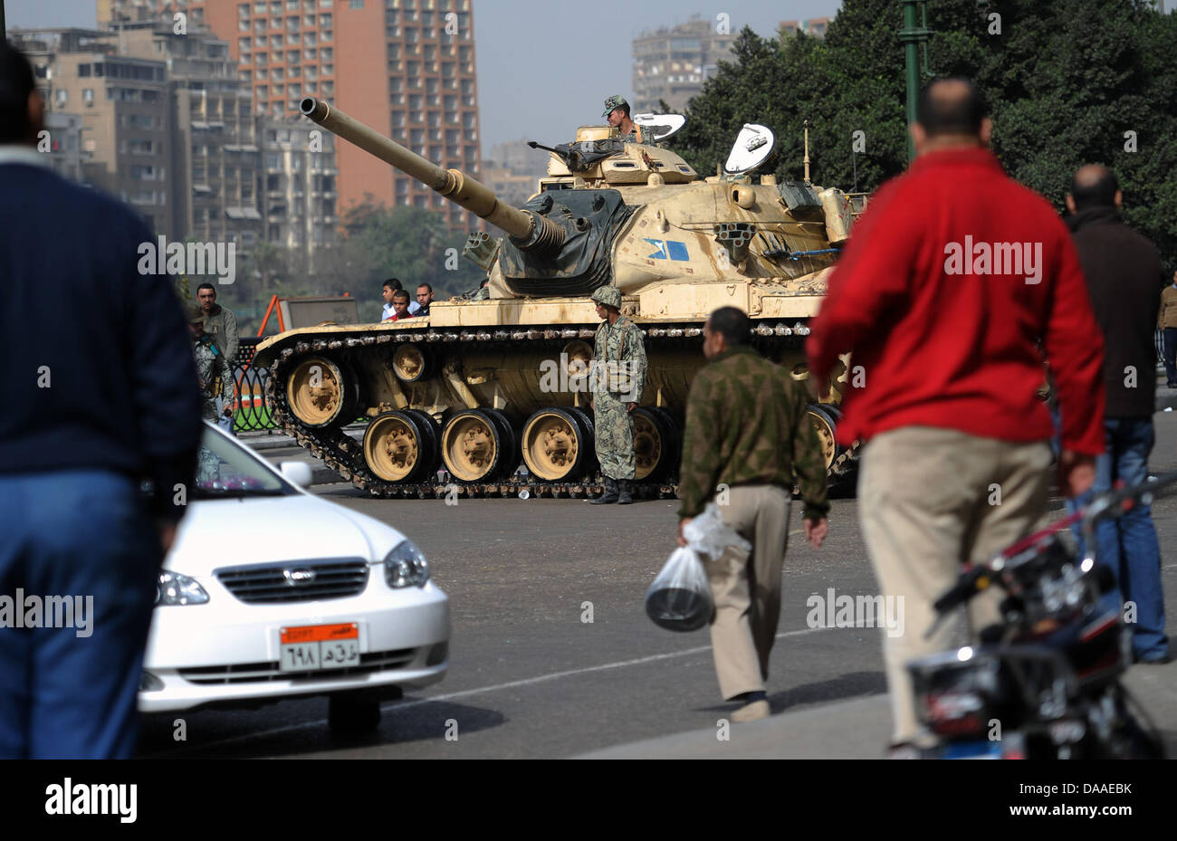 Soldiers with a tank block a street in the inner city of Cairo, Egypt ...