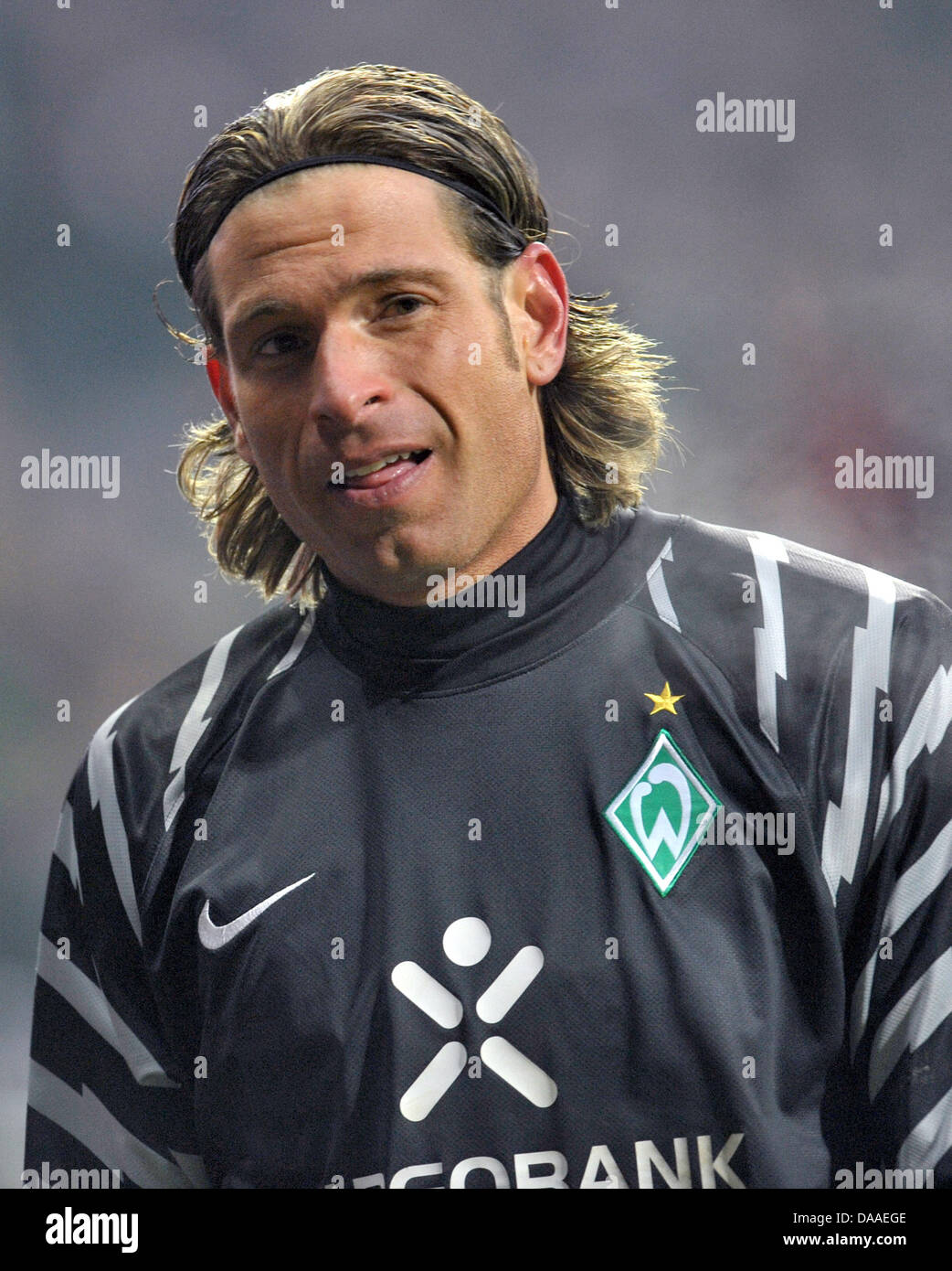 Bremen's goalkeeper Tim Wiese walks off the pitch after being red ...
