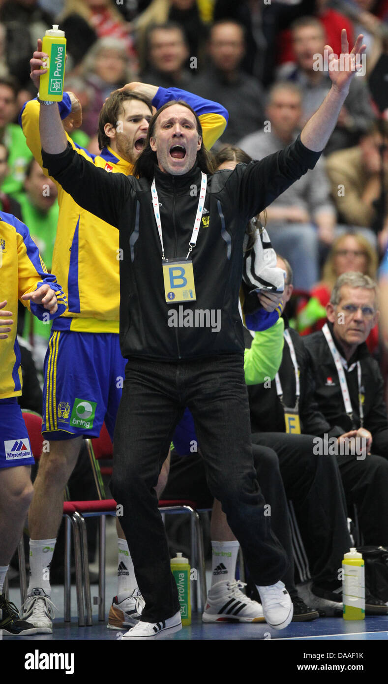 Staffan Olsson (C), coach of Sweden, reacts during the Men's Handball ...