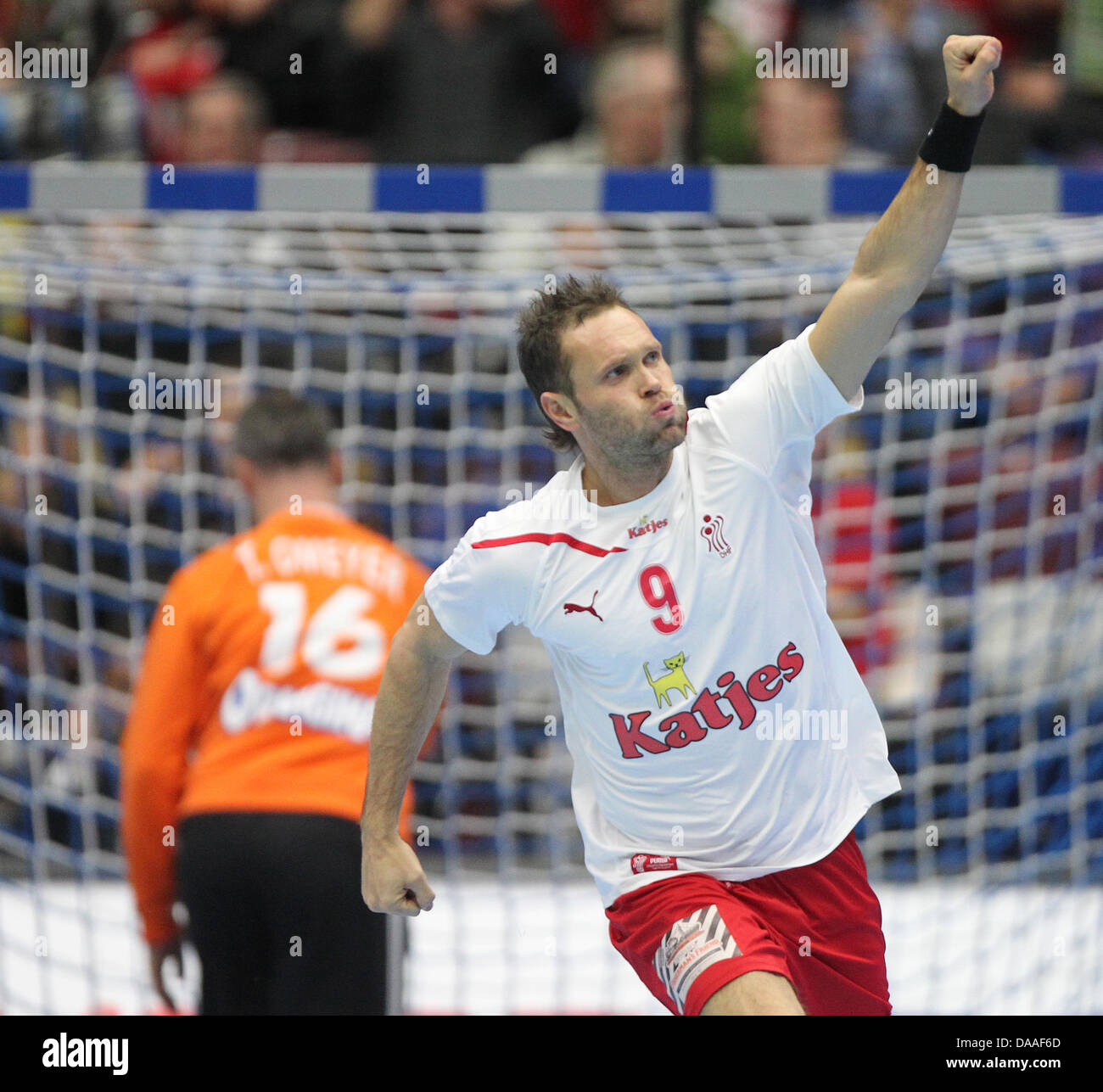 Lars Christiansen (R) of Denmark celebrates after scoring during the ...