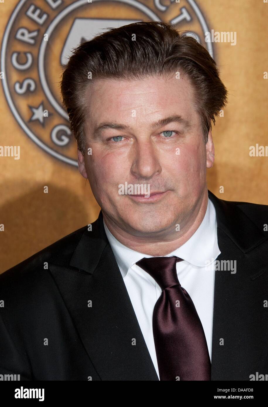 US actor Alec Baldwin of '30 Rock' holds up his award for Best Male ...
