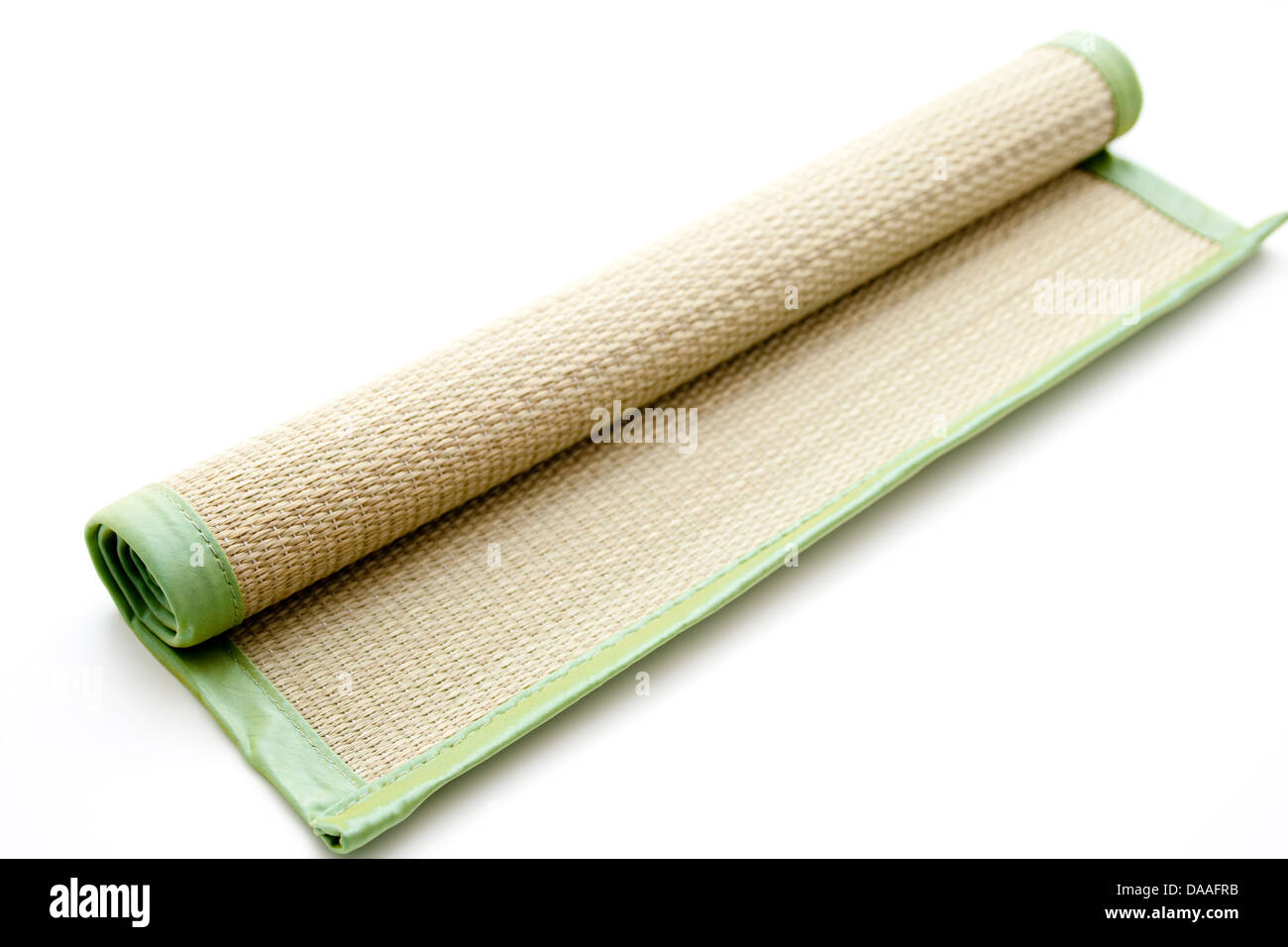 Rolled clothes line mat Stock Photo - Alamy