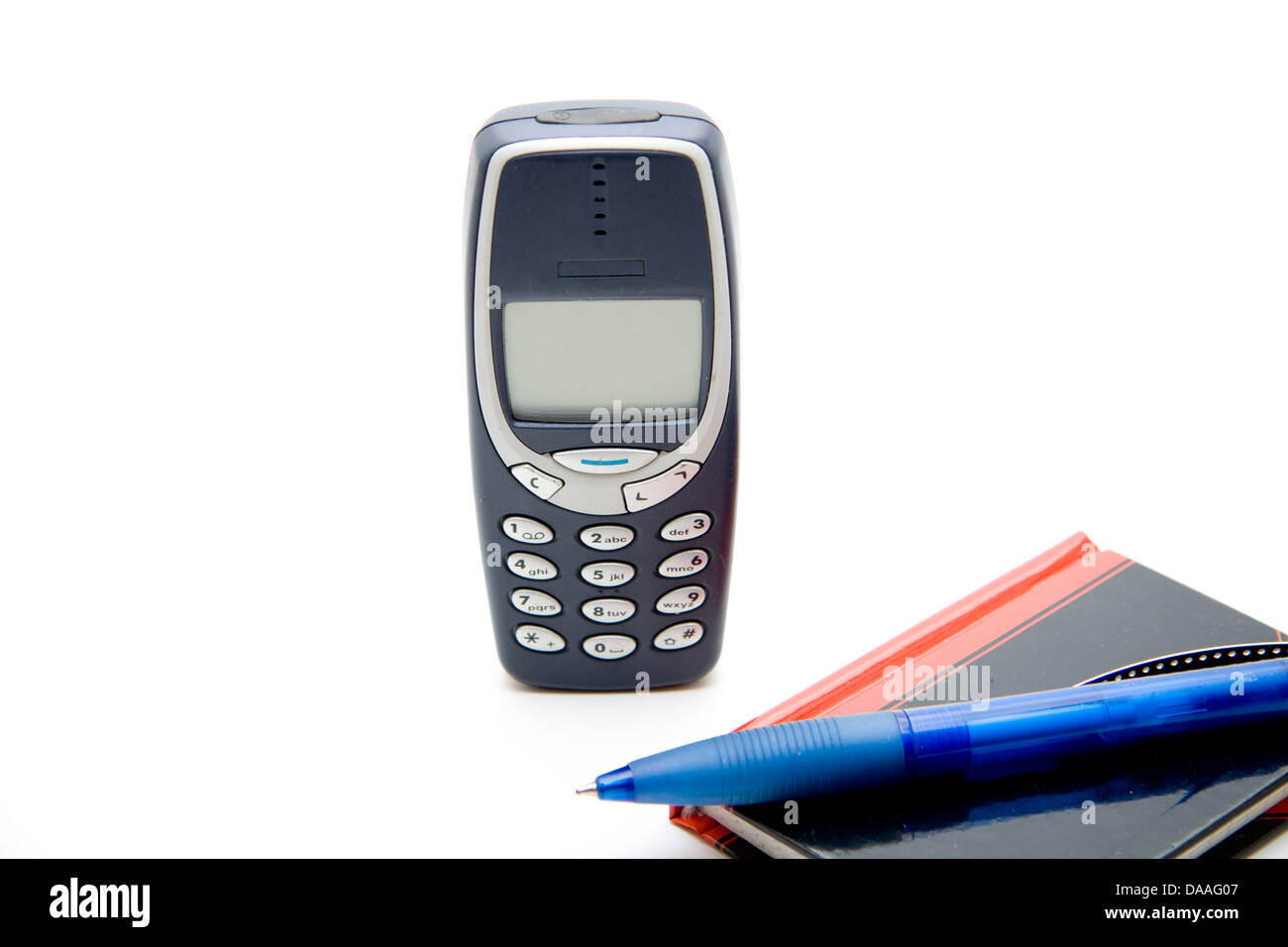 Mobile phone with notebook Stock Photo - Alamy