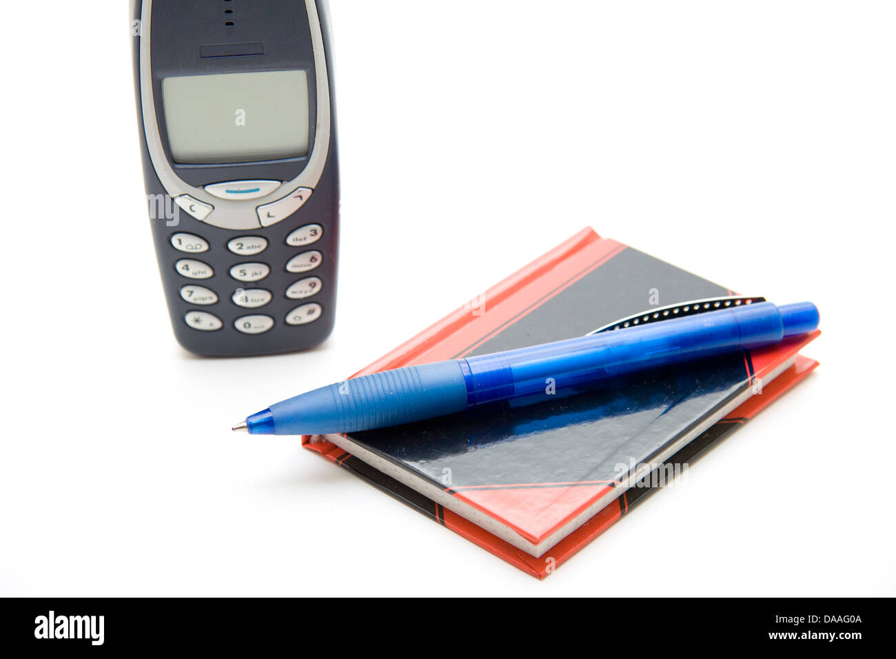 Mobile phone with notebook Stock Photo - Alamy