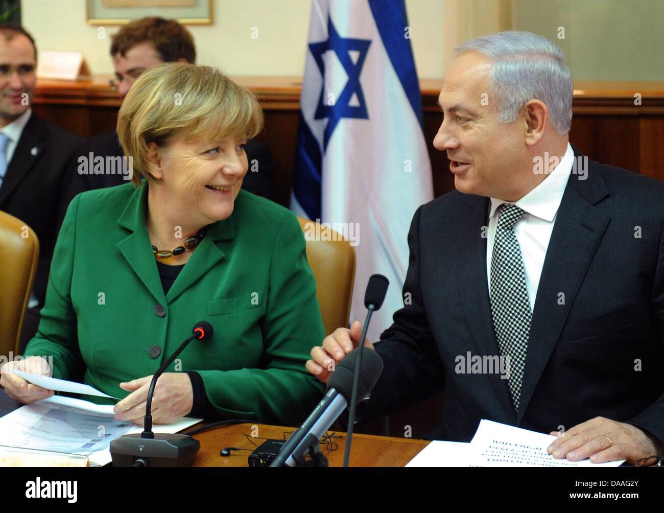 The Prime Minister of Israel, Benjamin Netanyahu, sits next to German ...