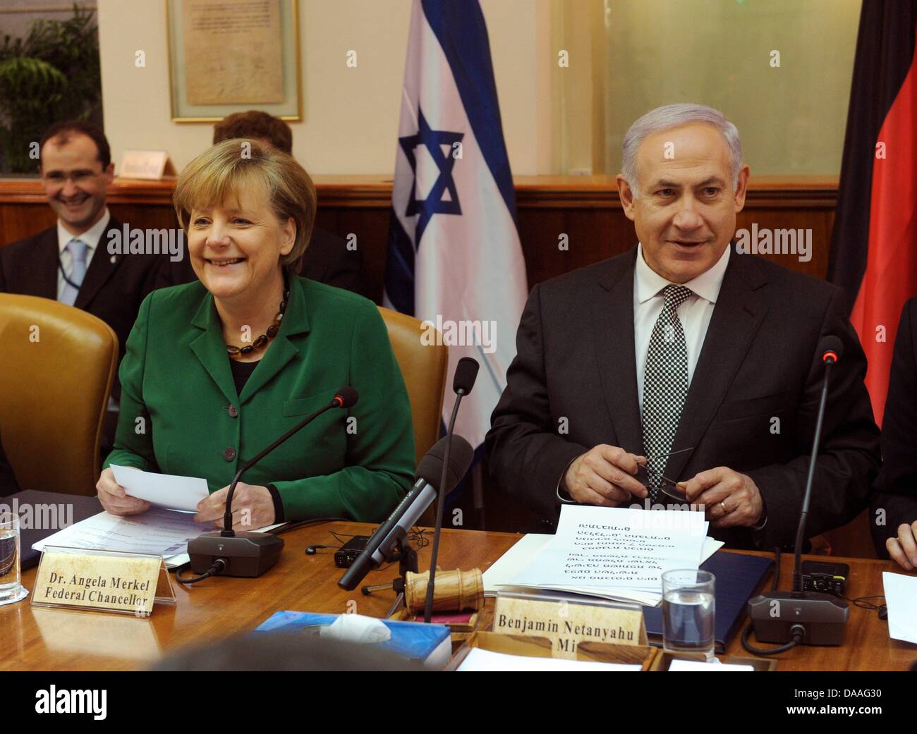 The Prime Minister of Israel, Benjamin Netanyahu, sits next to German ...