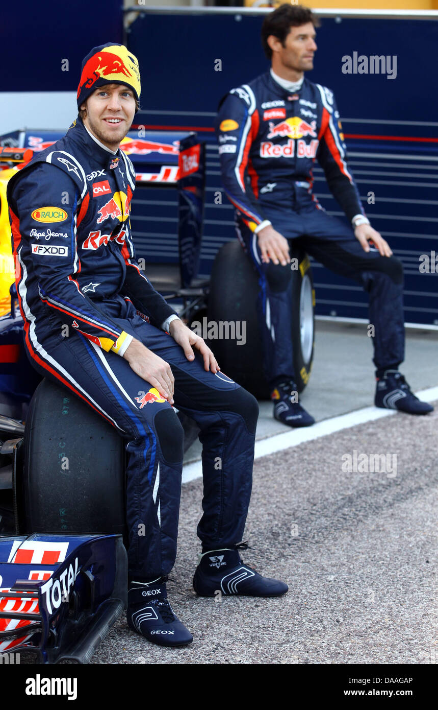 German Formula One driver Sebastian Vettel (L) and his Australian team ...
