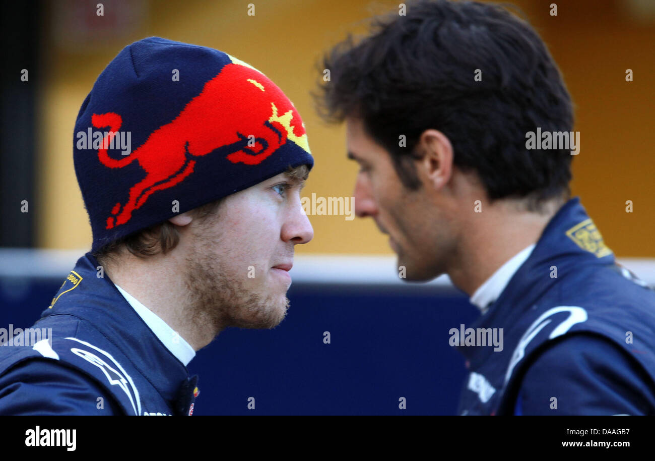 German Formula One driver Sebastian Vettel (L) and his Australian team ...