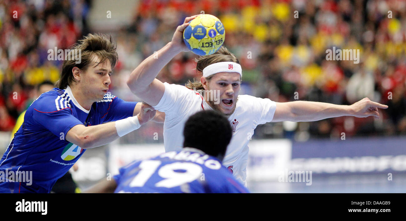 Mikkel Hansen (R) of Denmark against Xavier Barachet (L) and Luc Abalo ...