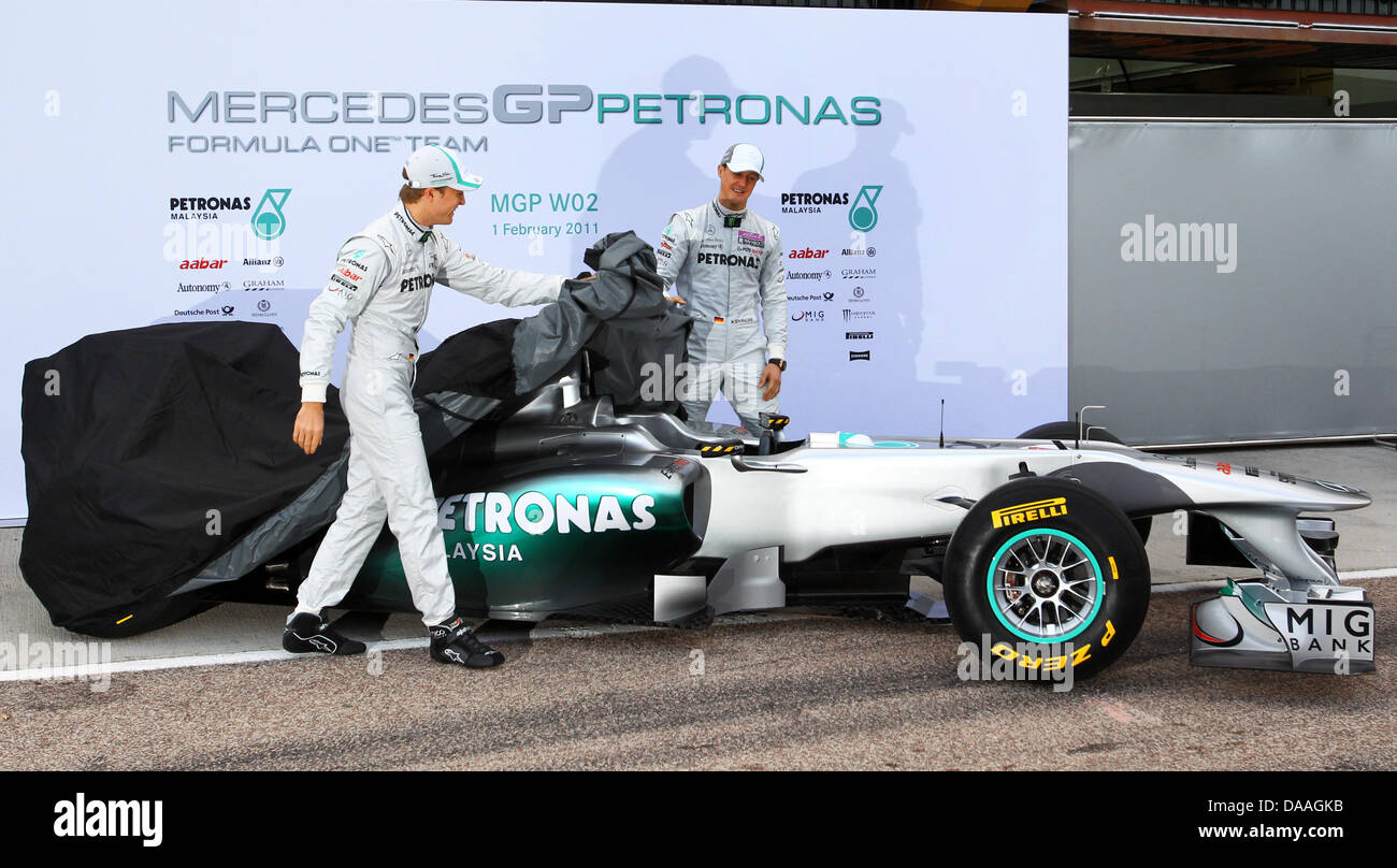 German Formula One driver Michael Schumacher (R) and his compatriot ...