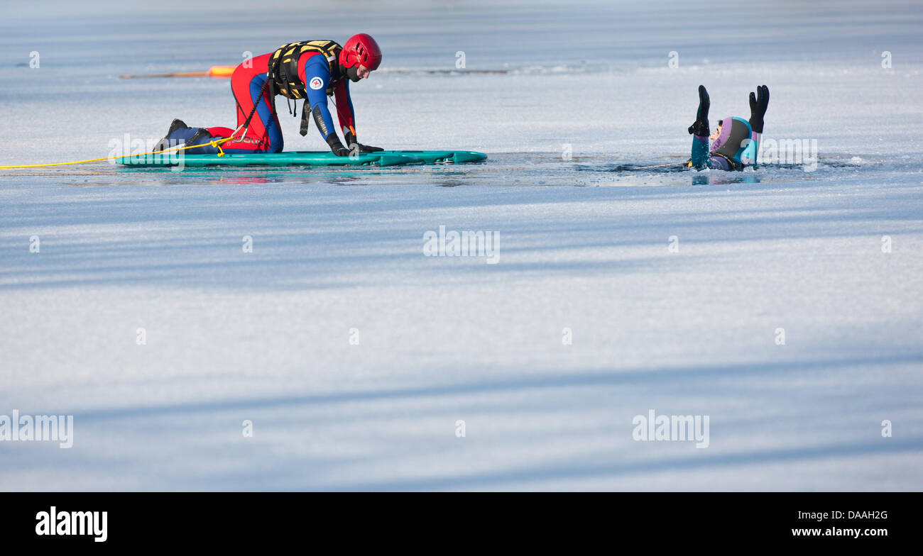 An emergency helper of the German Red Cross Water Rescue team takes ...