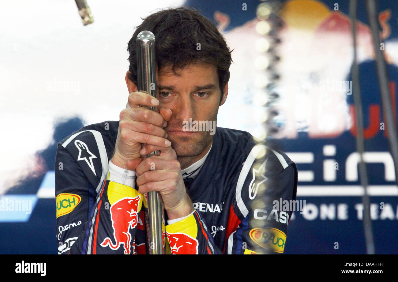 Australian Formula One race driver Mark Webber of Red Bull waits for ...