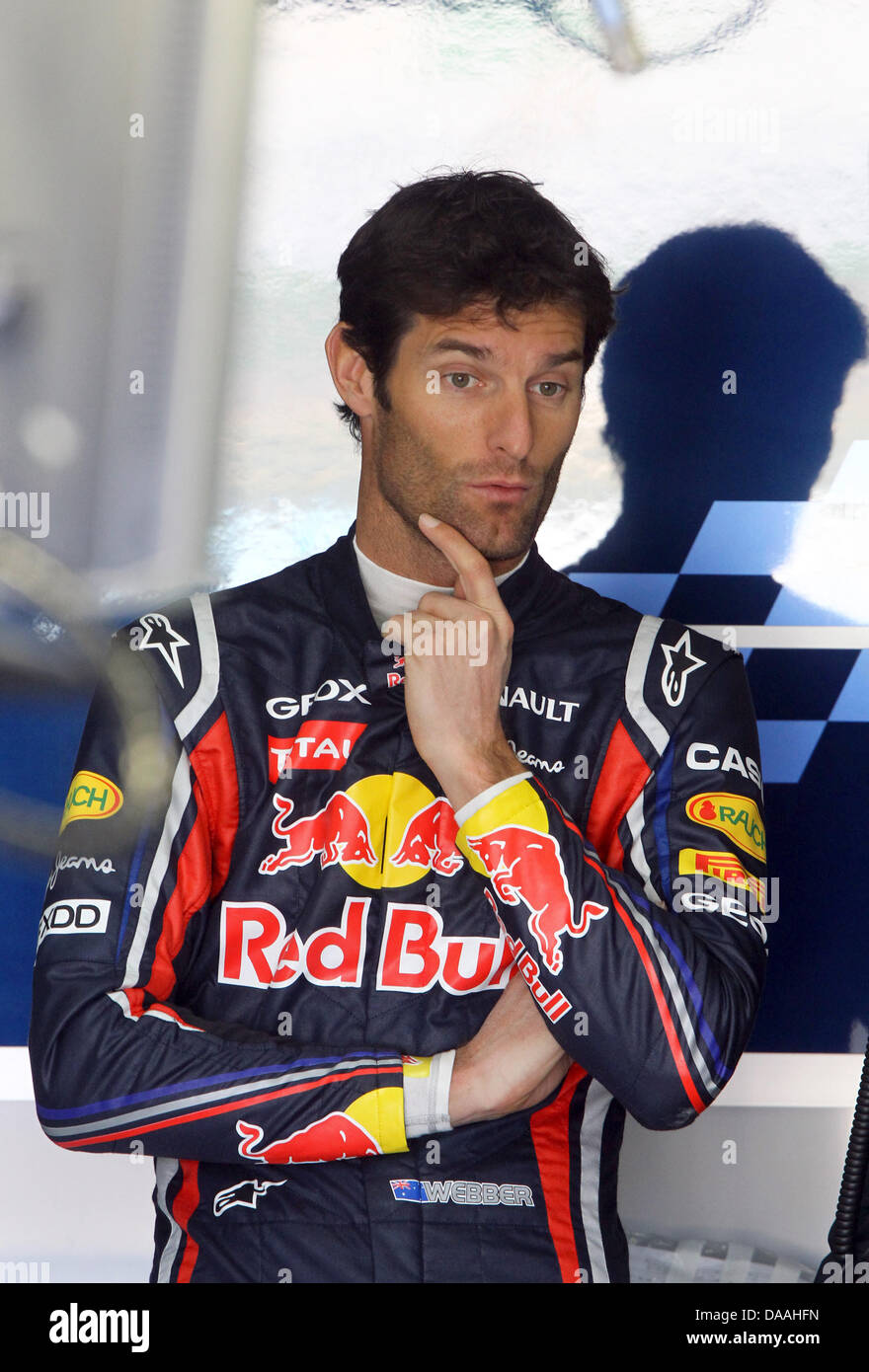 Australian Formula One race driver Mark Webber of Red Bull observes ...