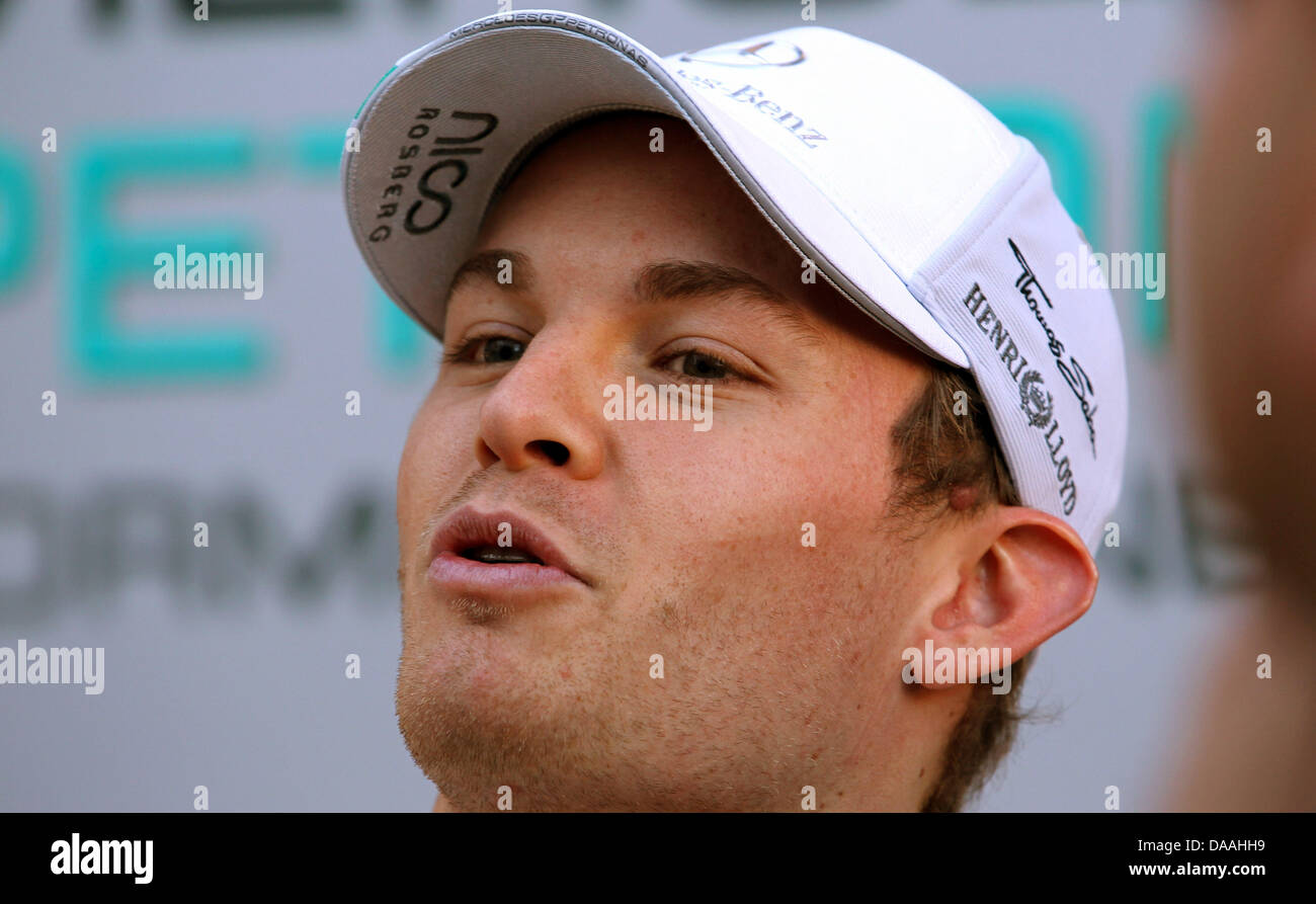 German Formula One race driver Nico Rosberg of Mercedes GP speaks to ...
