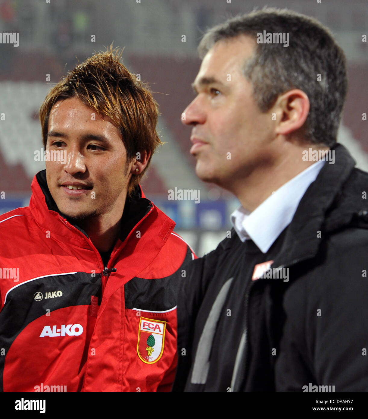 Augsburg's Hajimi Hosogai (L) appears at the stadium for the first time ...