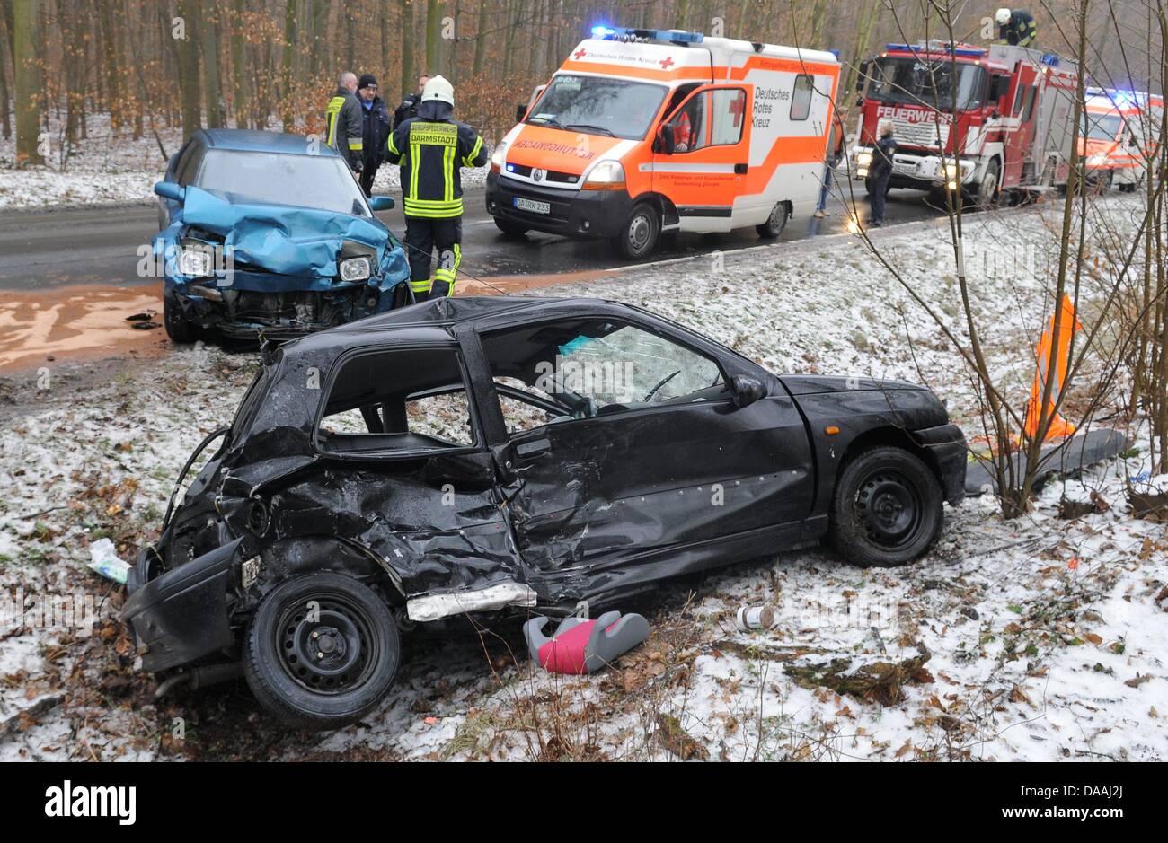 Firemen and rescue workers at the site of a car crash near Darmstadt ...