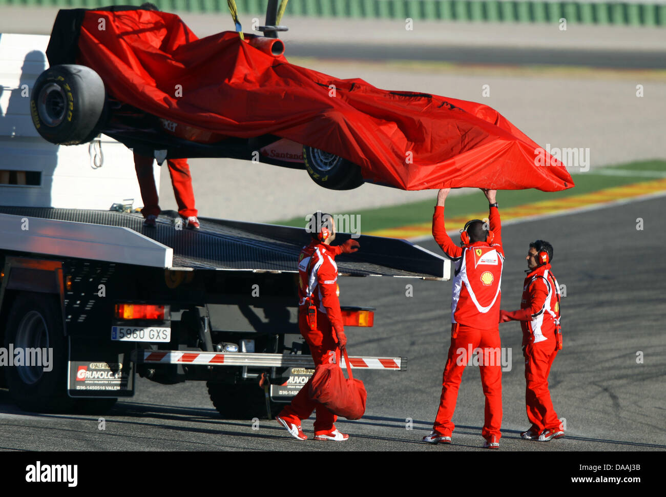 Mechanists of load the race car of Brazilian Formula One race driver ...