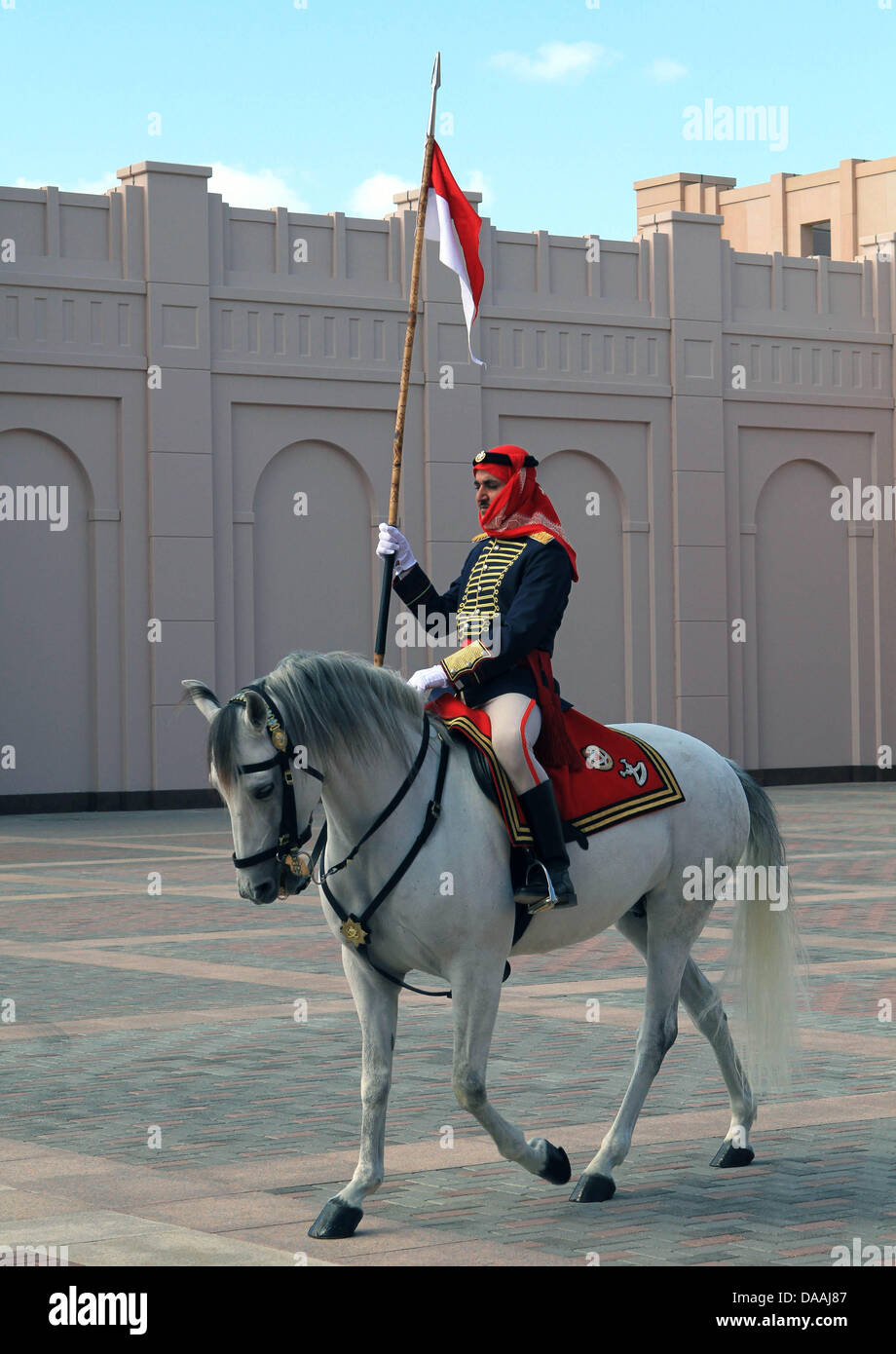 A guard on horseback watches over the arrival of Danish Queen Margrethe ...