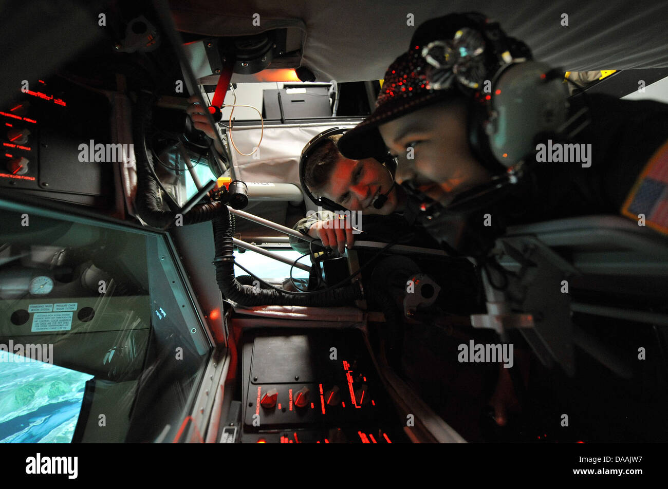 Senior Airman Kyle Engasser, 384th ARS boom operator, helps Esmeralda ...