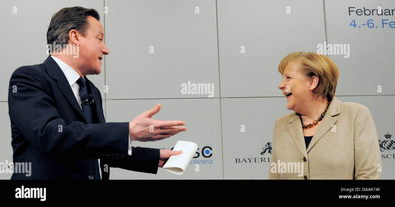 German Chancellor Angela Merkel gestures besides British Prime Minister ...