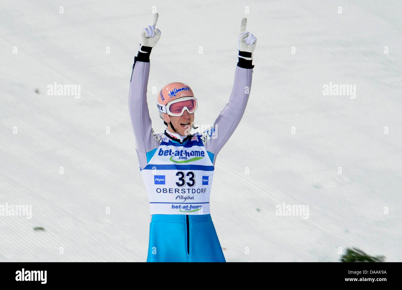 Austrian ski jumper Martin Koch cheers after his jump during the Ski ...