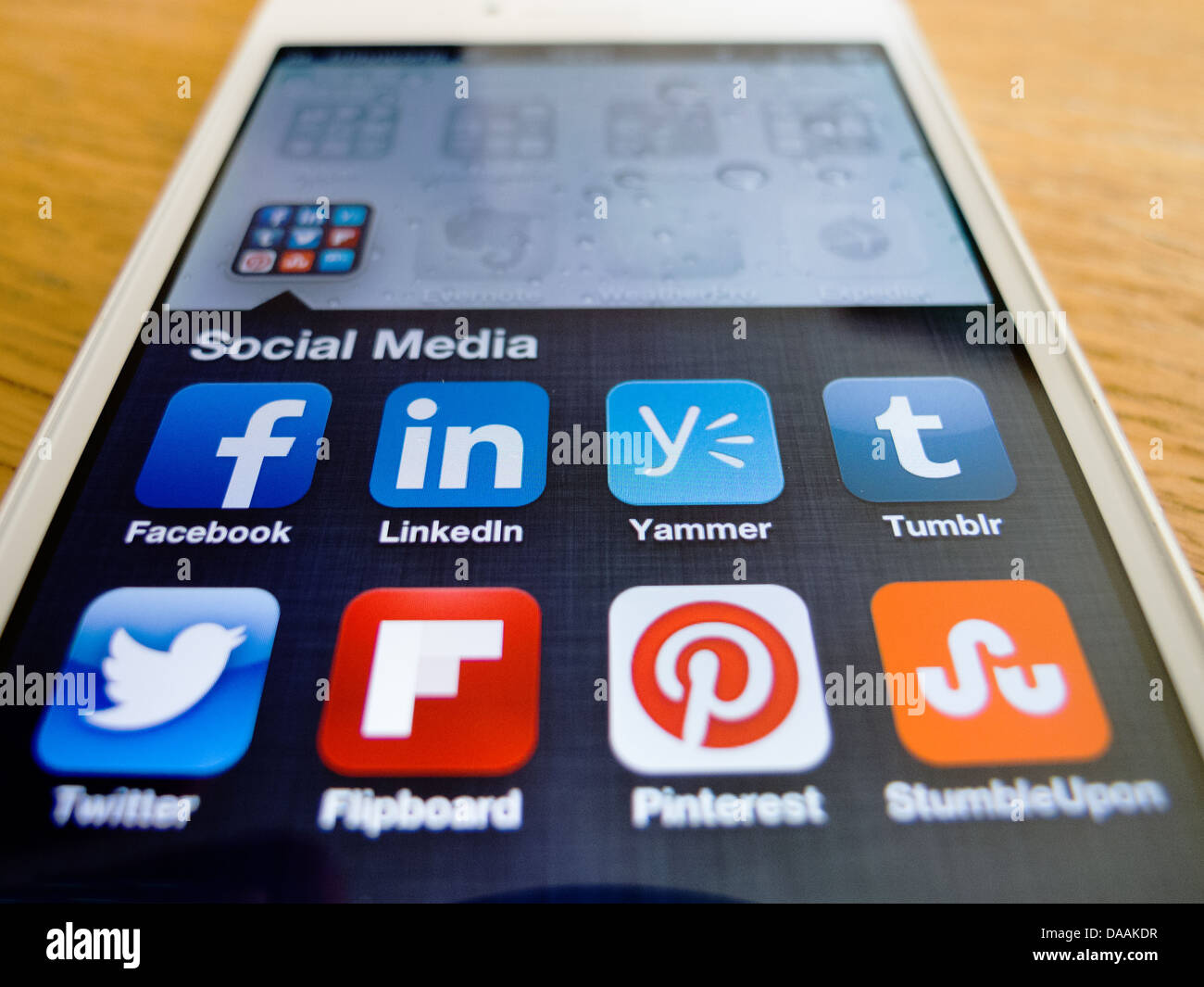 Detail of iPhone 5 smart phone screen showing social media apps icons ...