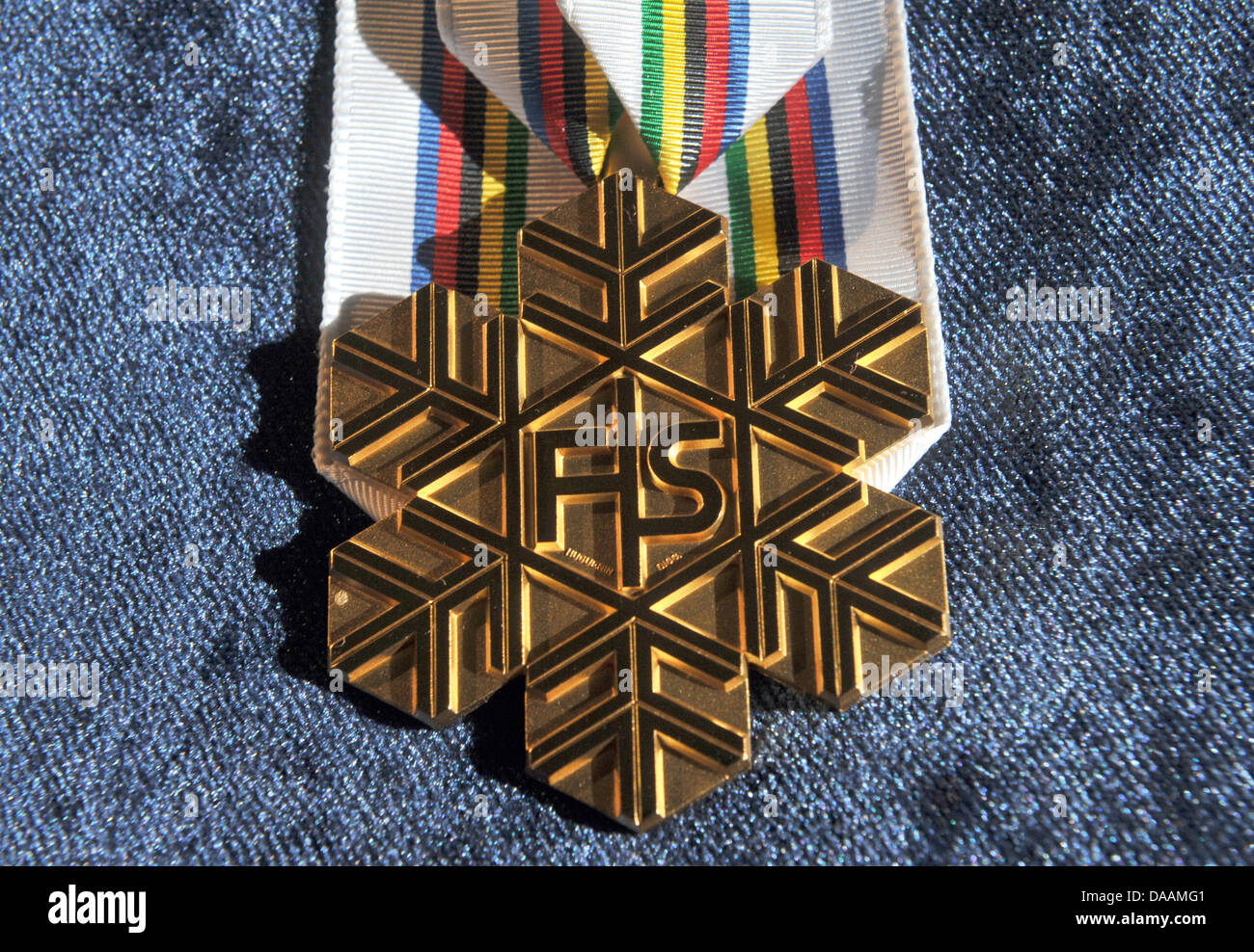 The medals of the International Ski Association FIS in gold is ...